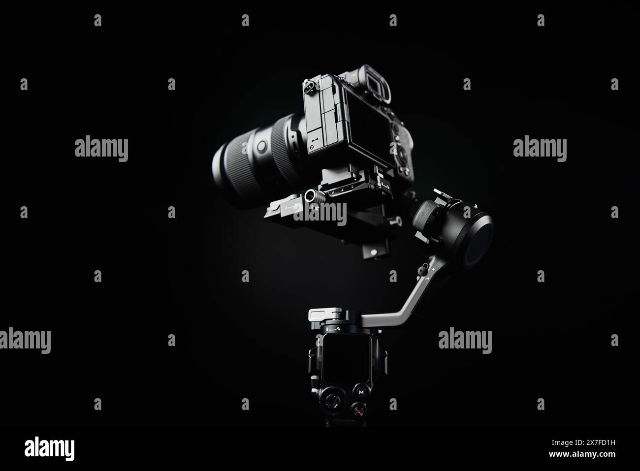 Camera mounted on gimbal on dark background. Camera stabilization ...