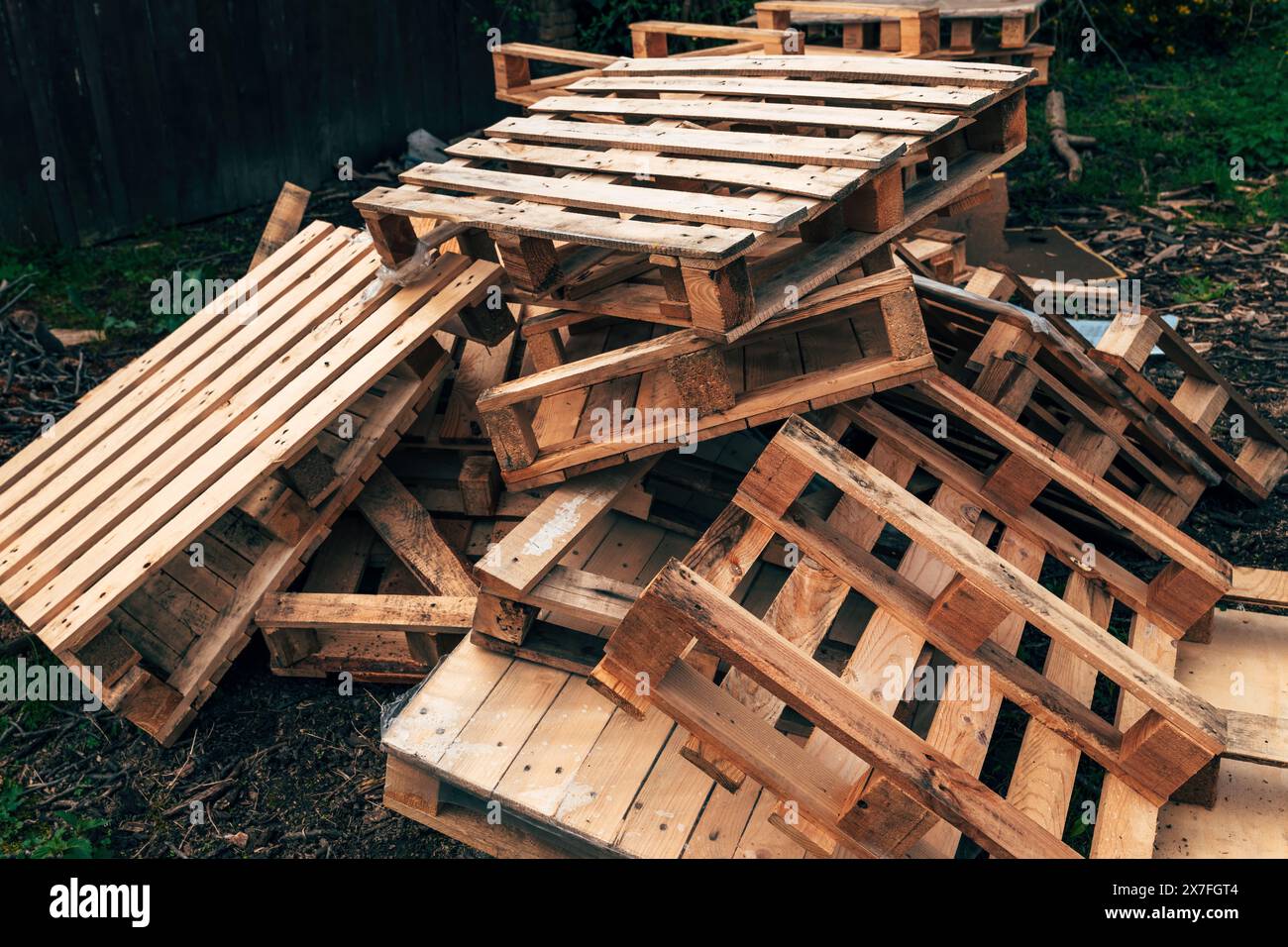 Pile of old used wooden Euro Pallets, selective focus Stock Photo - Alamy