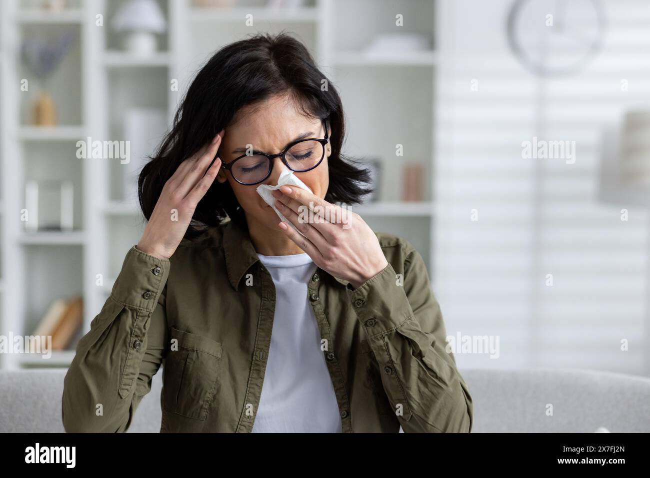 Woman wiping nose with hand hi-res stock photography and images - Alamy