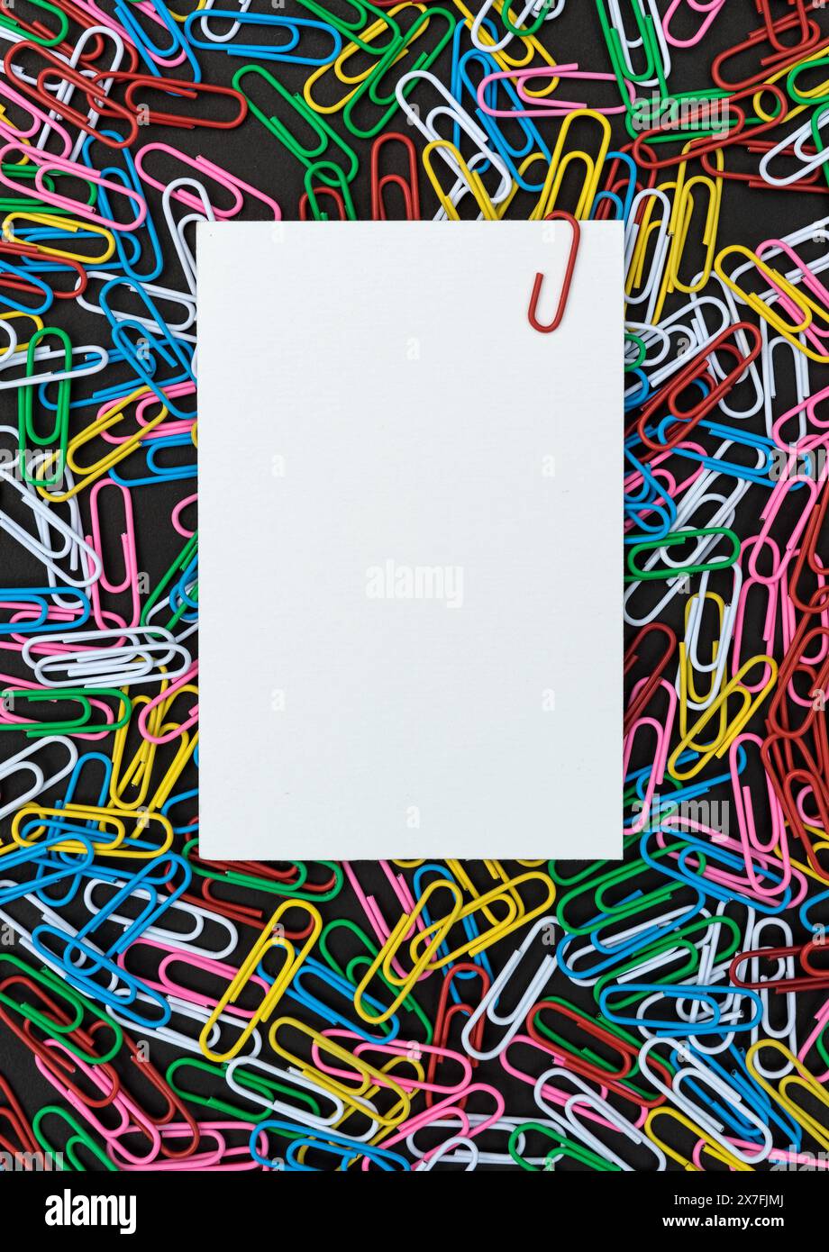 View from above of a Background with colorful paper clips and paper ...