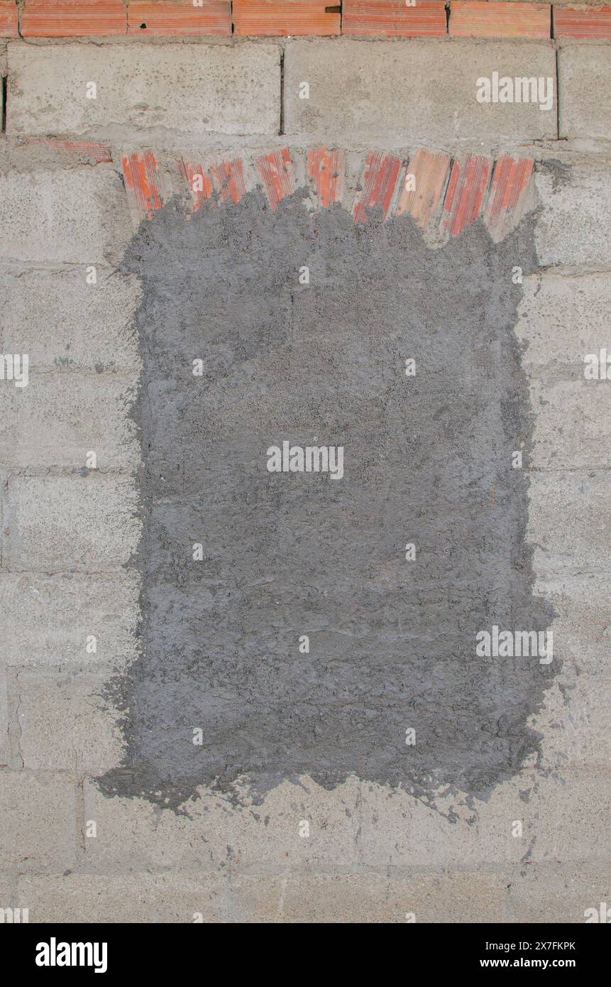 concrete block wall with a bricked-up window Stock Photo - Alamy