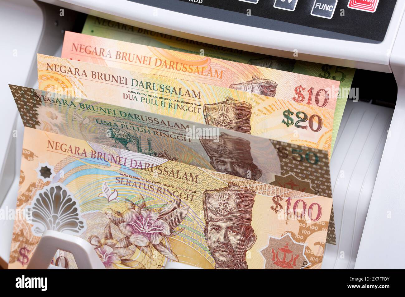 Brunei money - dollar in a counting machine Stock Photo - Alamy
