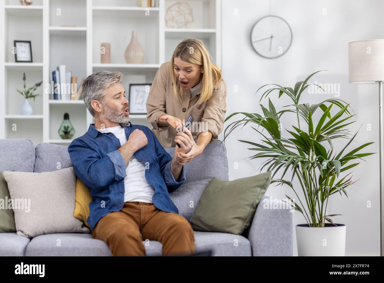 Woman and man having an intense conversation after seeing a message on ...