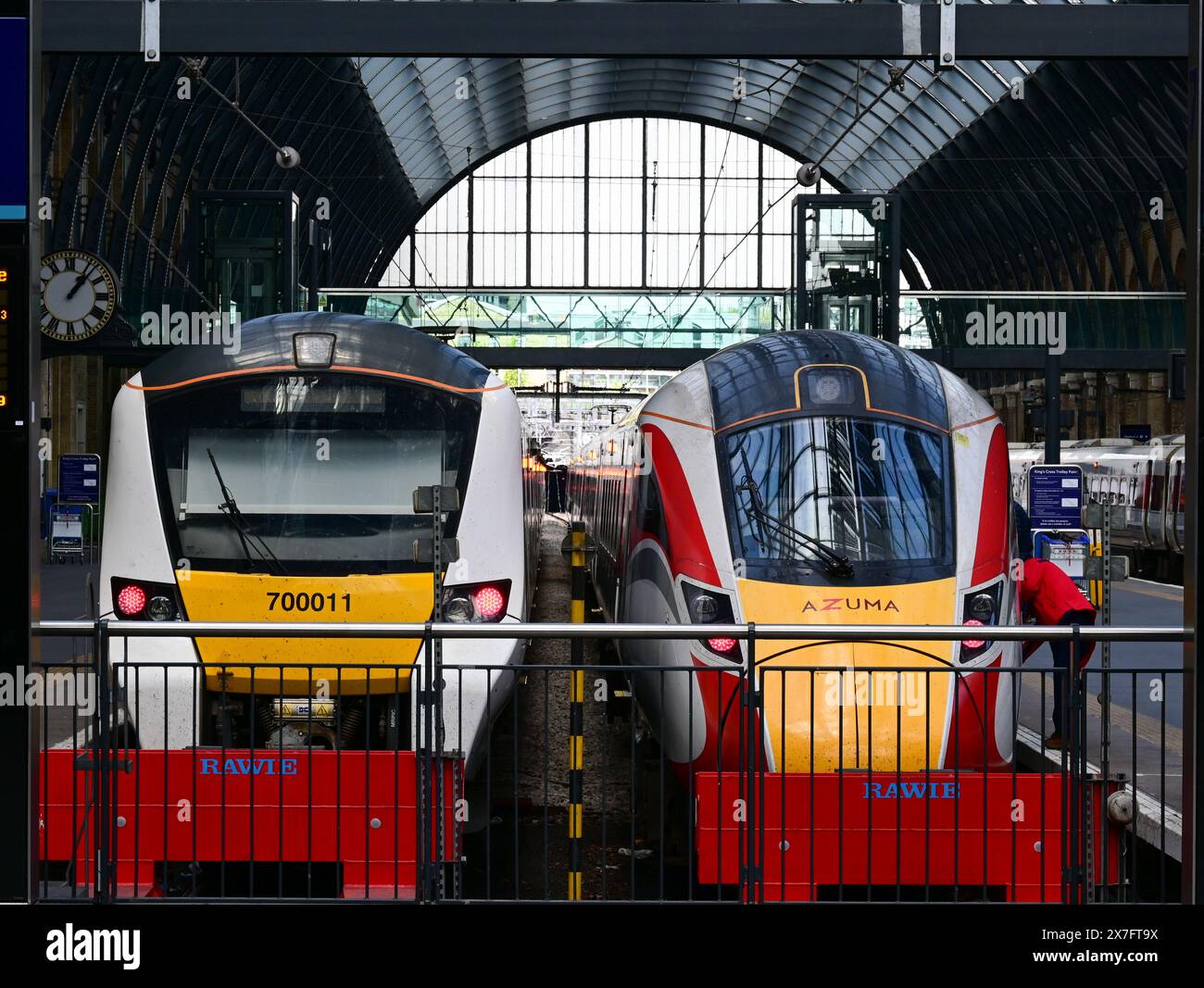 Class 700 EMU and Azuma high speed trains at platform ends, King's Cross station, London ...