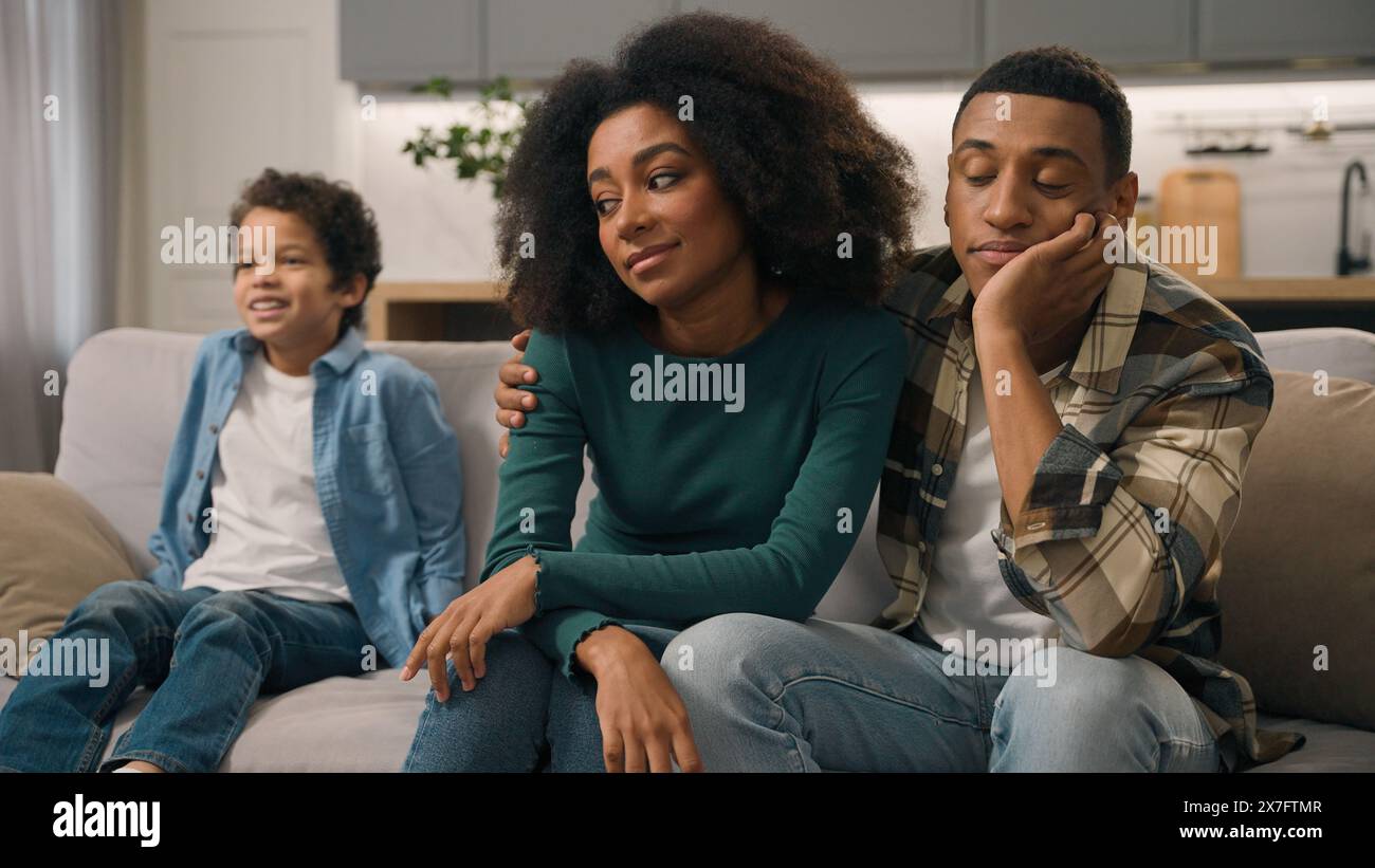 Sad African American family desperate parents hug unhappy mother woman ...