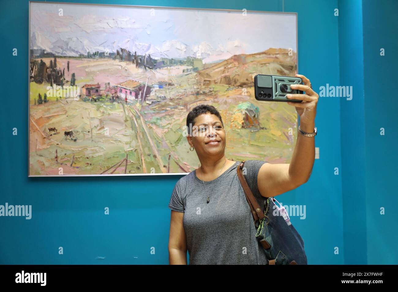 Suva, Fiji. 20th May, 2024. A visitor takes selfies at an exhibition of ...