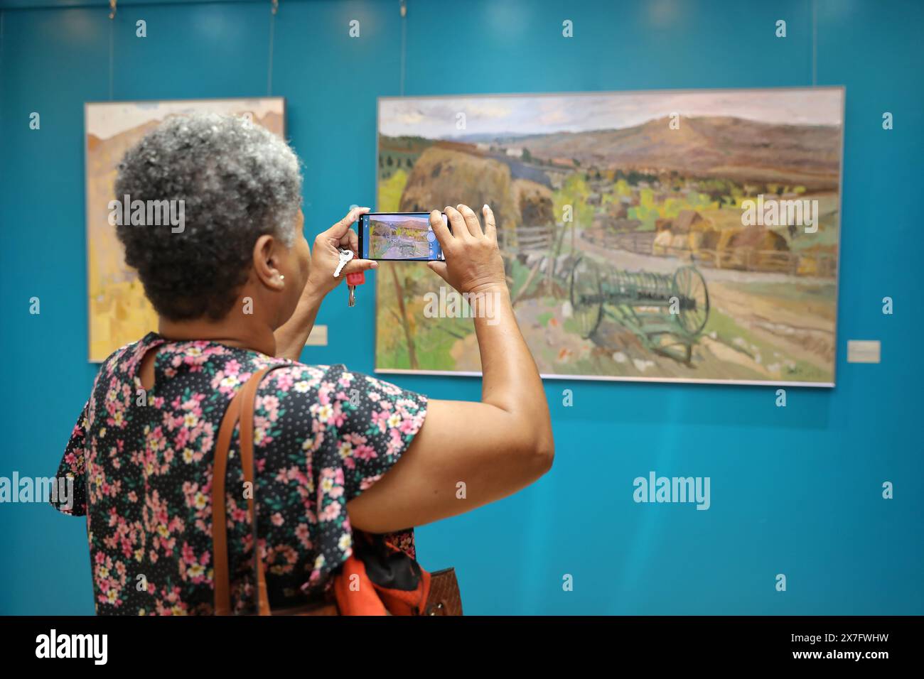 Suva, Fiji. 20th May, 2024. A visitor takes photos at an exhibition of ...