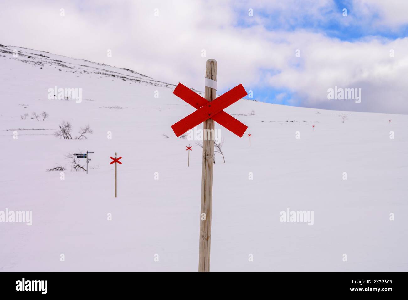 Red cross sign to mark the walking trail in Sonfjällets national park ...
