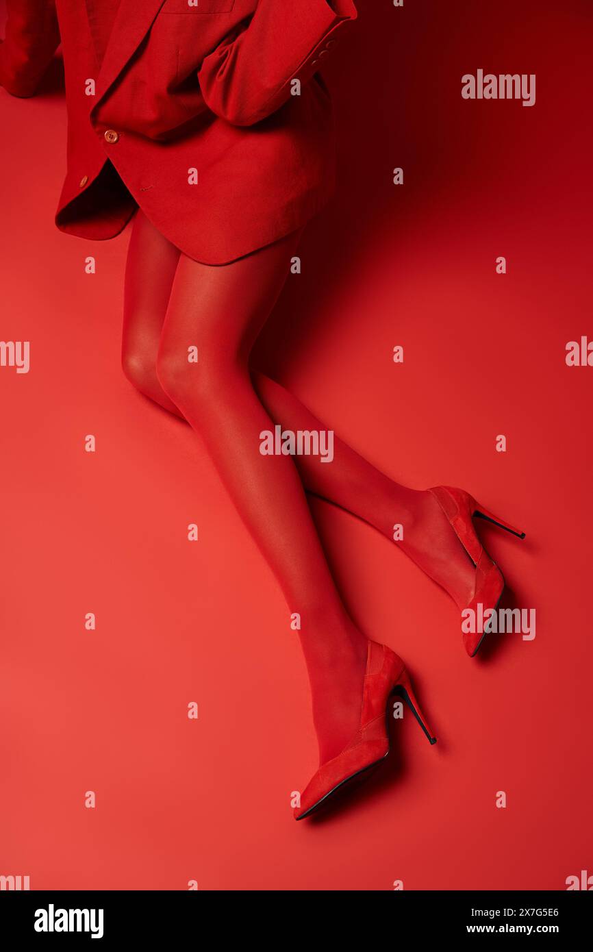 A young woman exudes elegance in a vibrant studio setting, wearing a ...