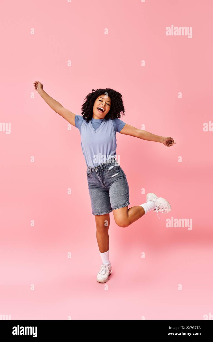 African woman jumping arms hi-res stock photography and images - Alamy