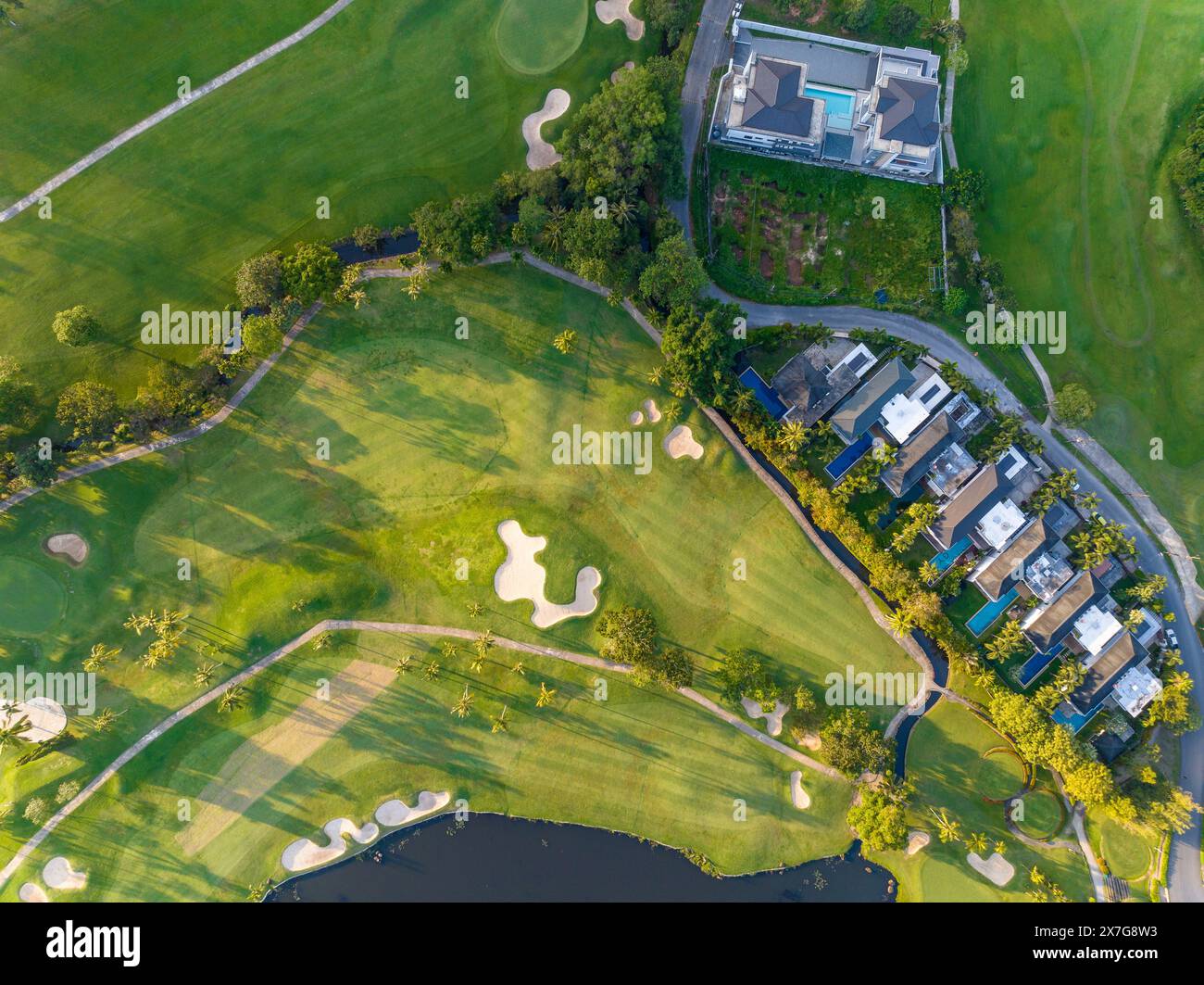 Aerial view of beautiful green golf field fairway and putting green ...