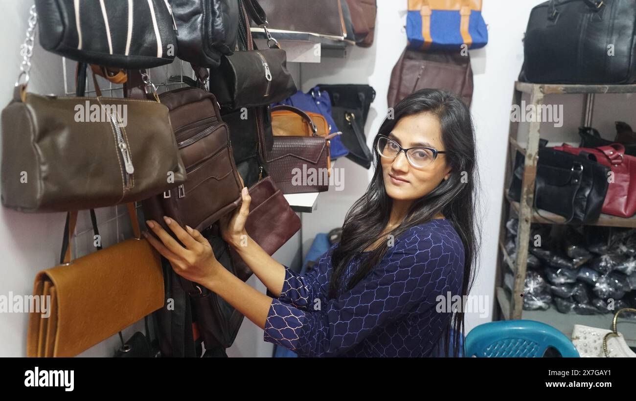 Dhaka. 20th May, 2024. A woman shows products at a stall during ...