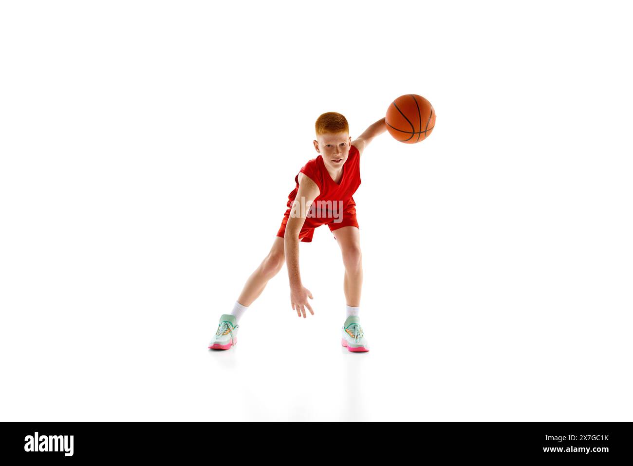 Motivated teen boy, basketball player in dynamic pose with ball ...