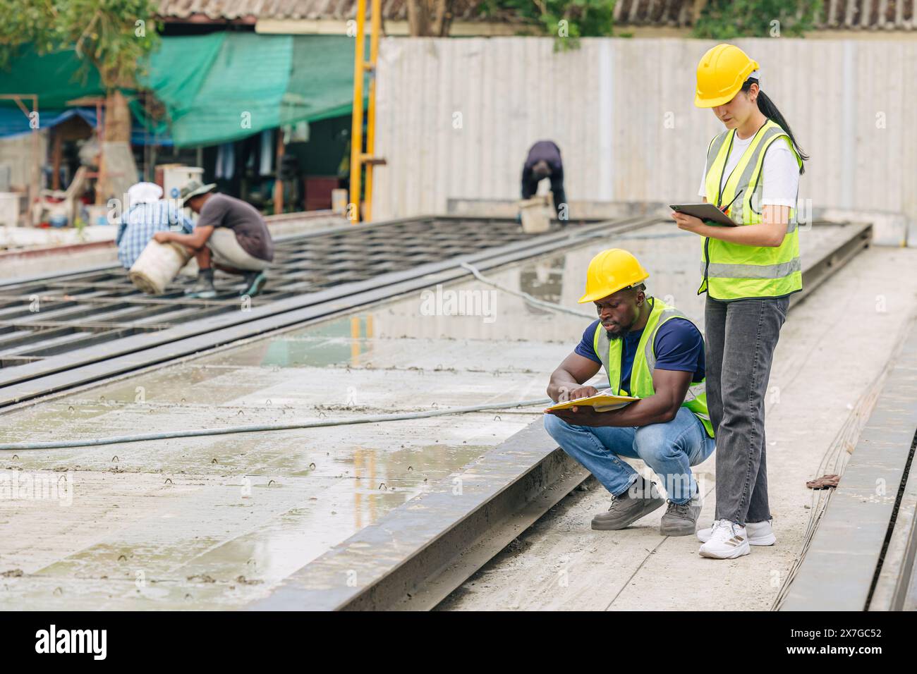 Engineer smart women working contact with African black worker in ...