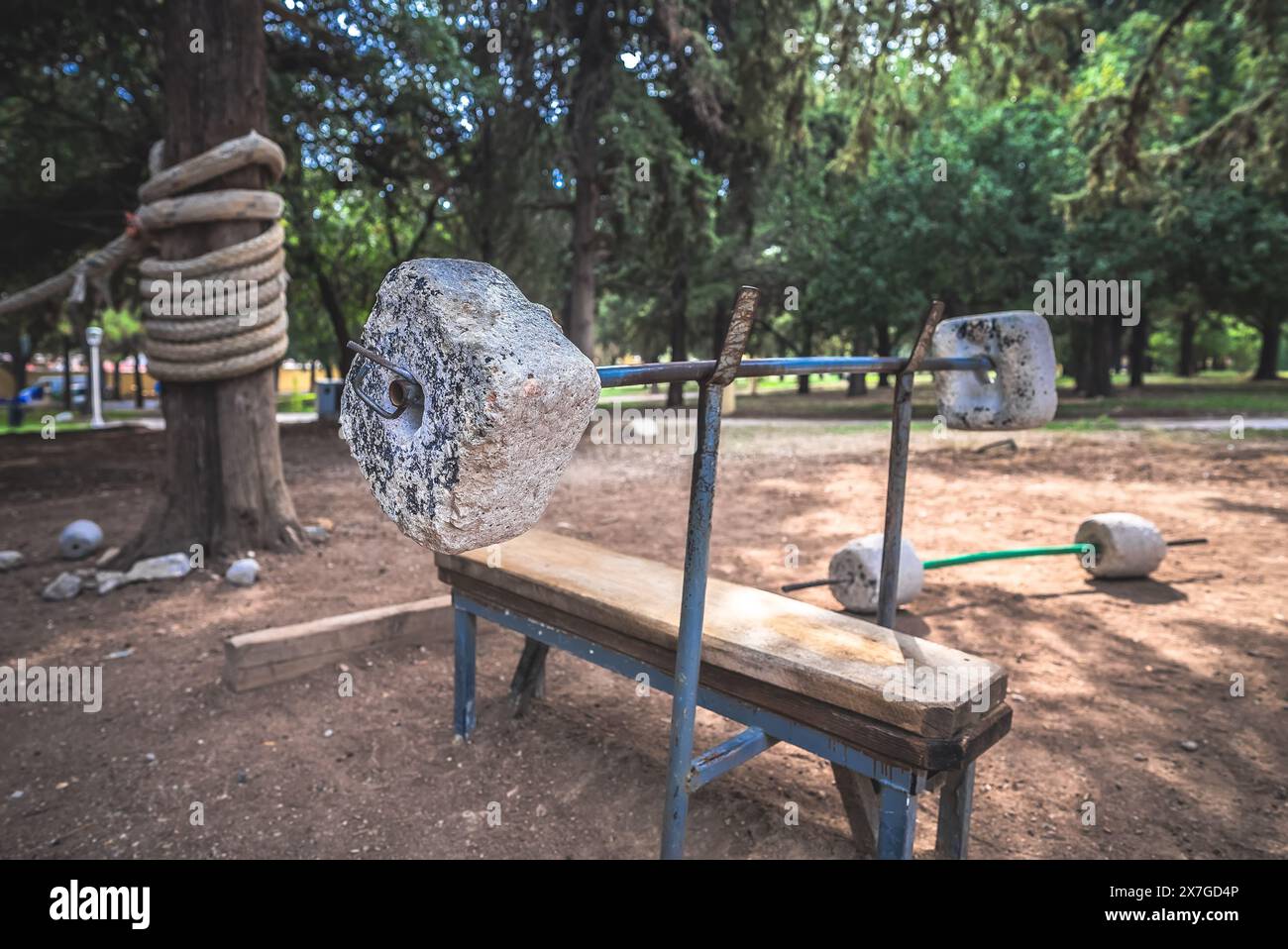 Improvised outdoor gym. Barbell made of reinforcement and concrete ...