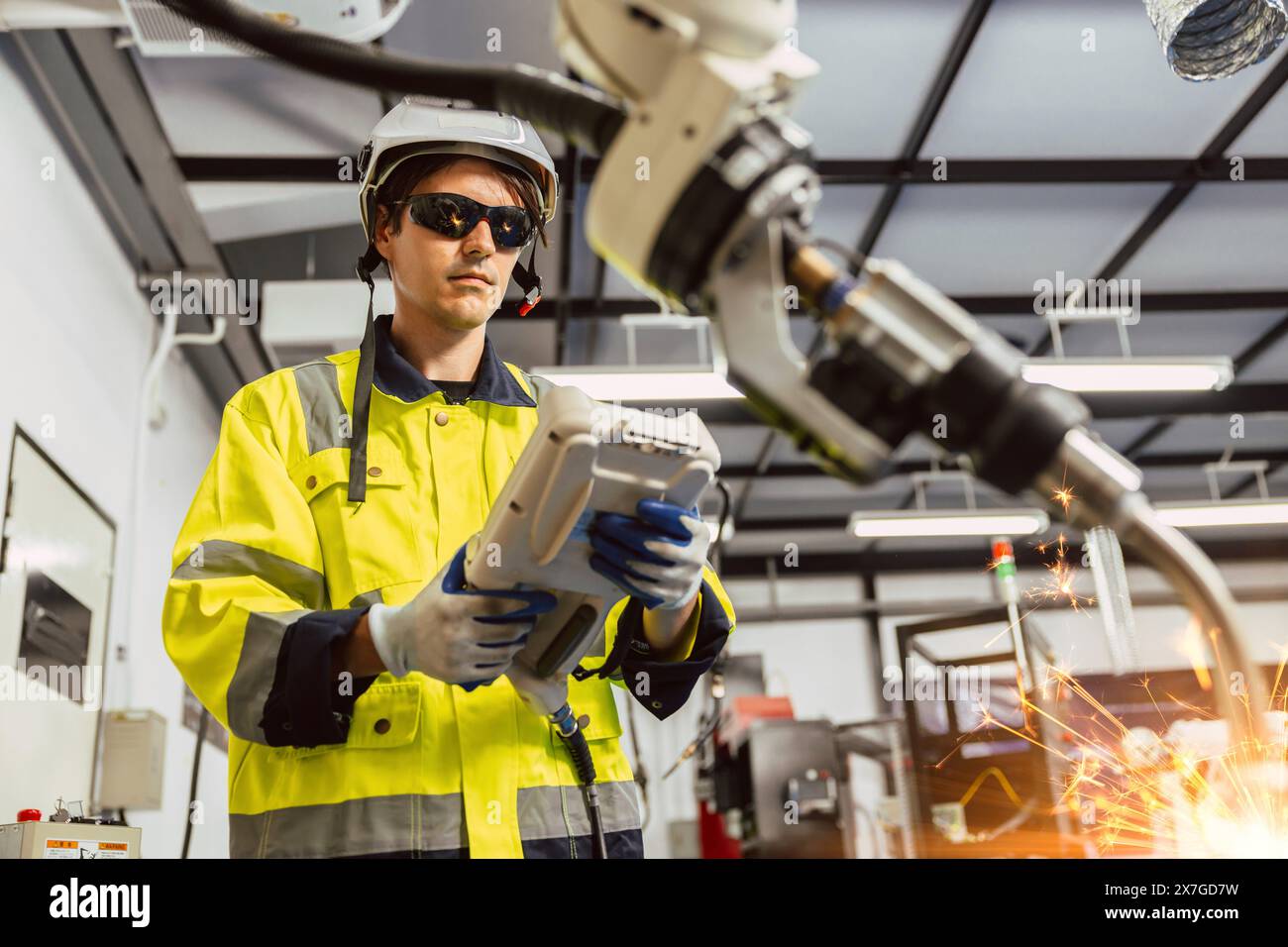 Engineer young man university student learn to control operate industry ...