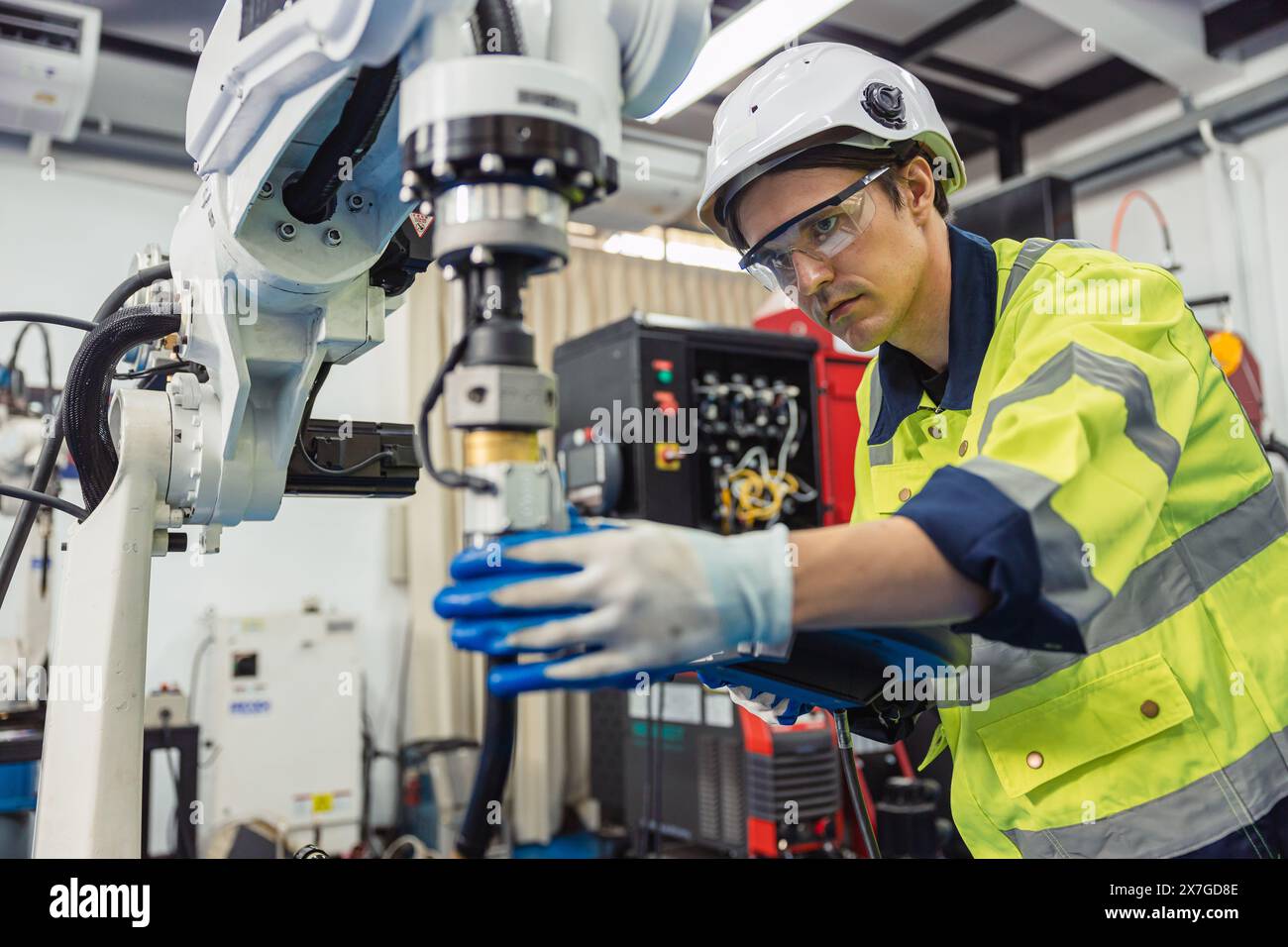Engineer young man university student learn to control operate industry ...