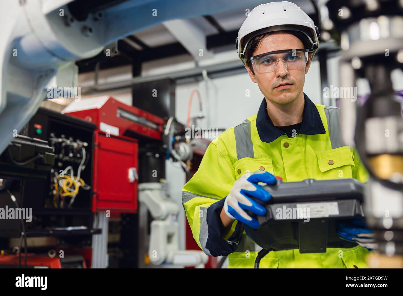 Engineer young man university student learn to control operate industry ...