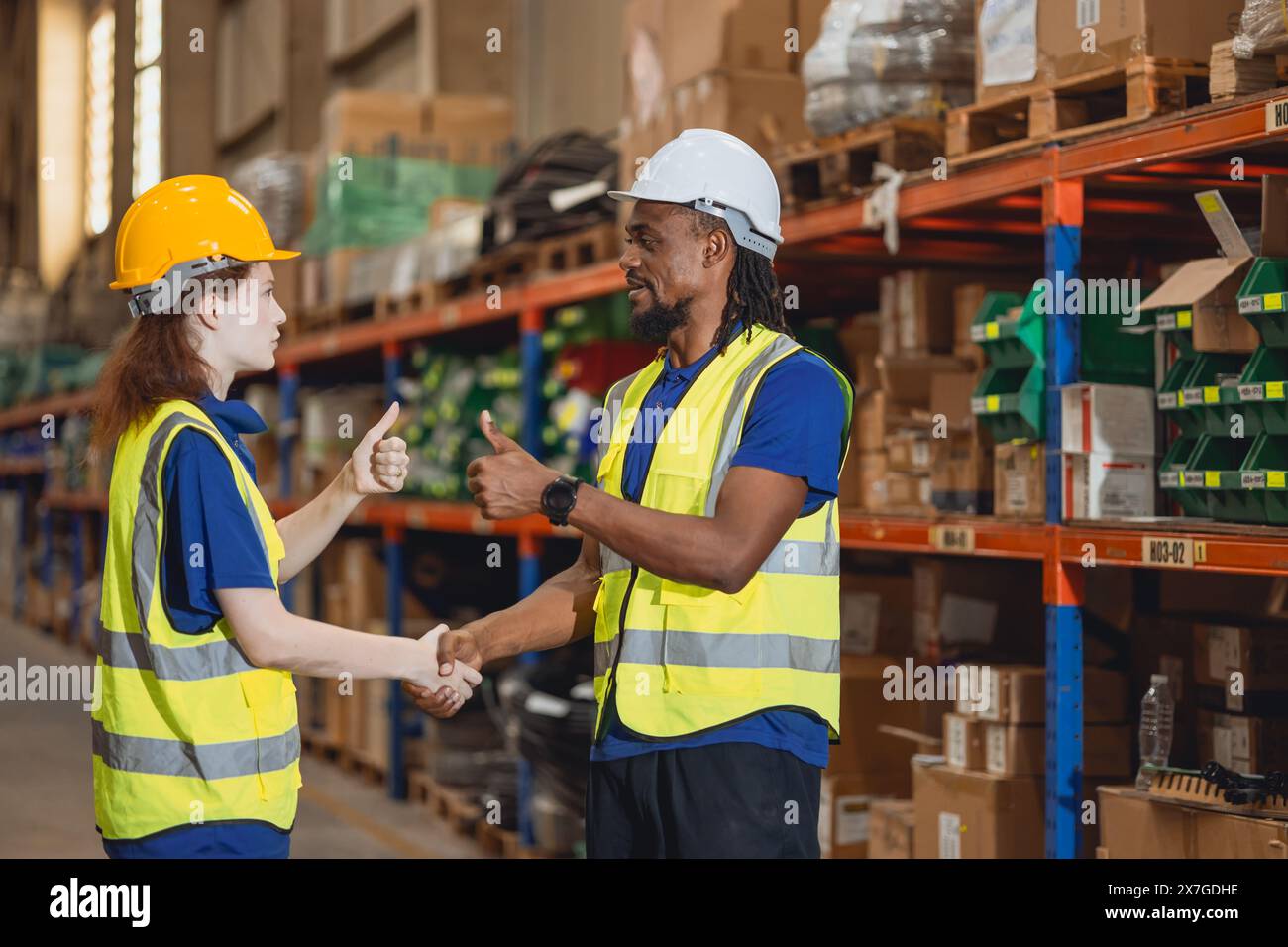 Worker in cargo warehouse teamwork support trainee young women with ...