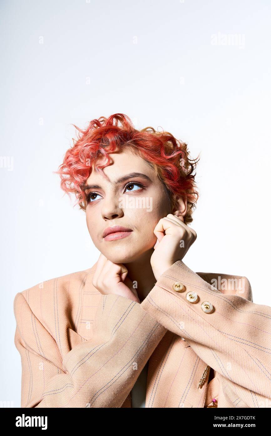 A vibrant woman with red hair strikes a pose for a photo Stock Photo ...