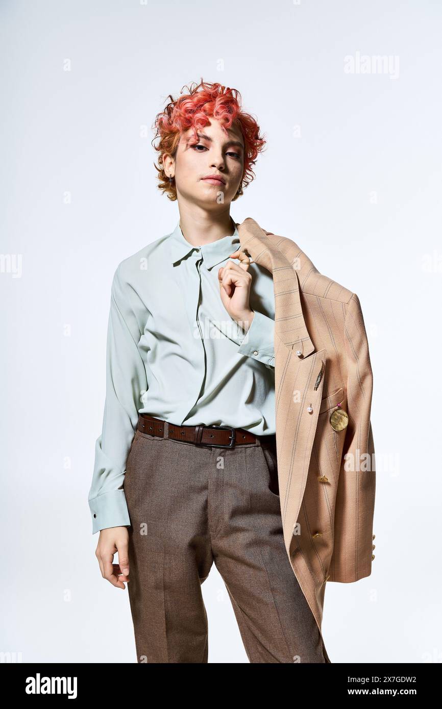 Extraordinary woman with vibrant red hair wearing a suit and tie poses ...