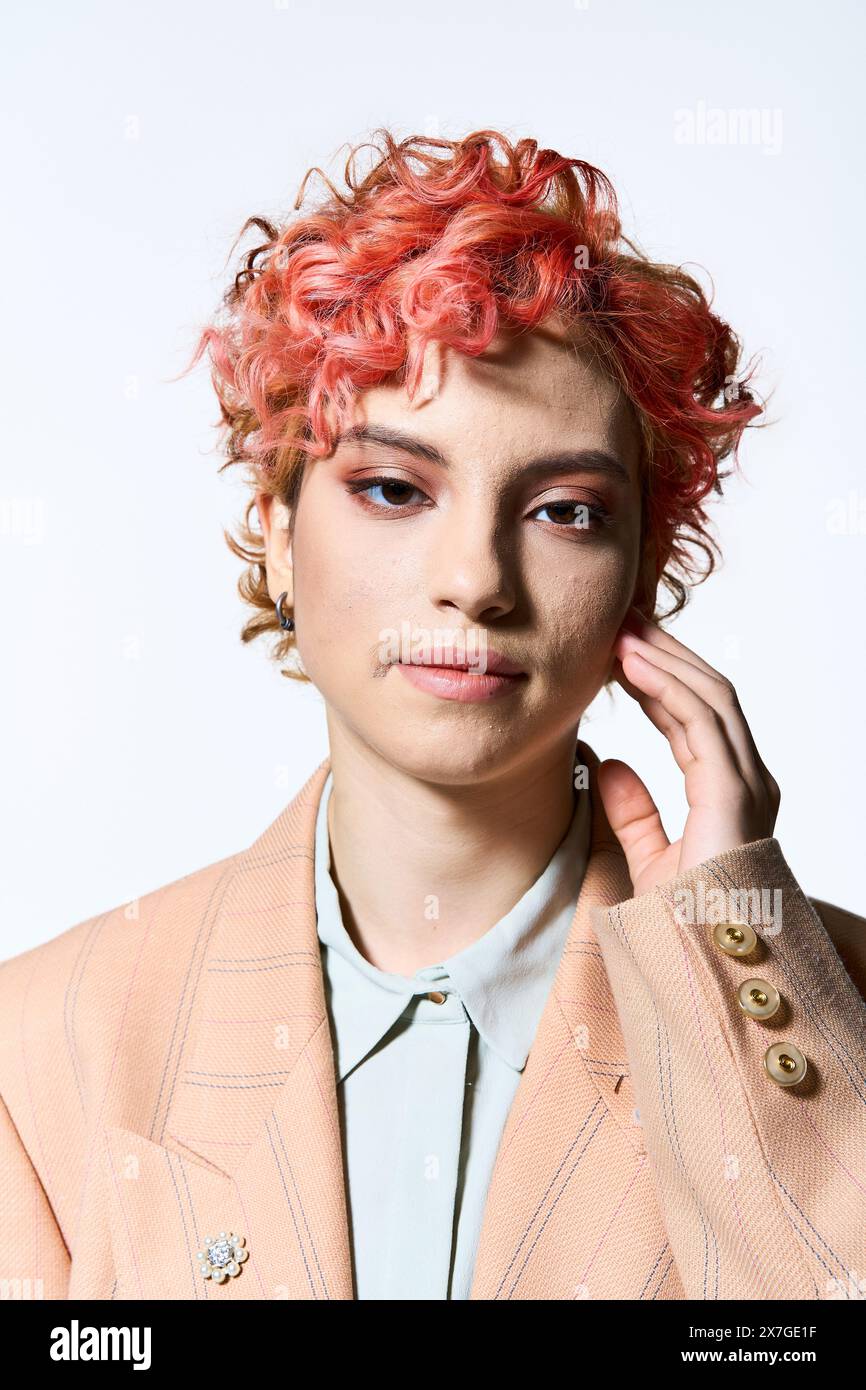 A striking woman with fiery red hair confidently wears a stylish suit ...