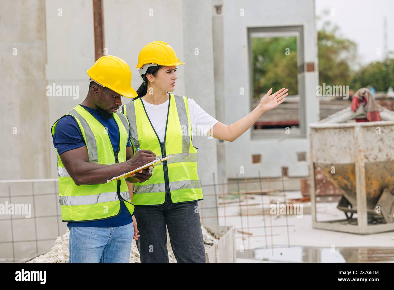 Engineer smart women working contact with African black worker in ...