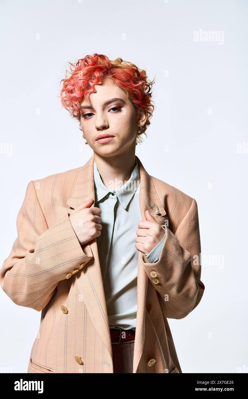 A vibrant woman with red hair strikes a pose for a picture Stock Photo ...