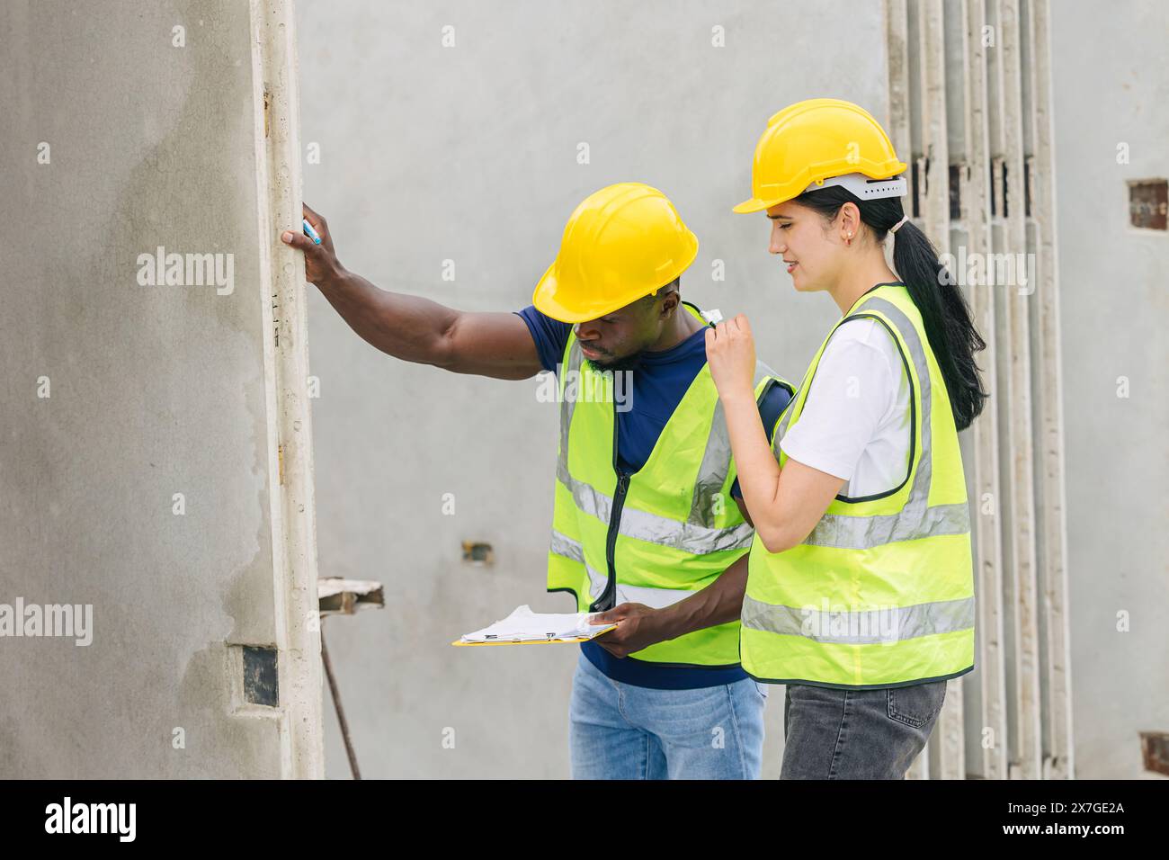 Engineer smart women working contact with African black worker in ...