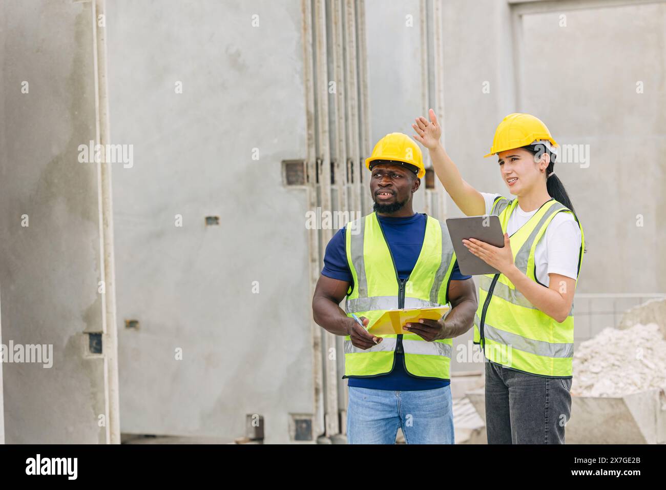 Engineer smart women working contact with African black worker in ...