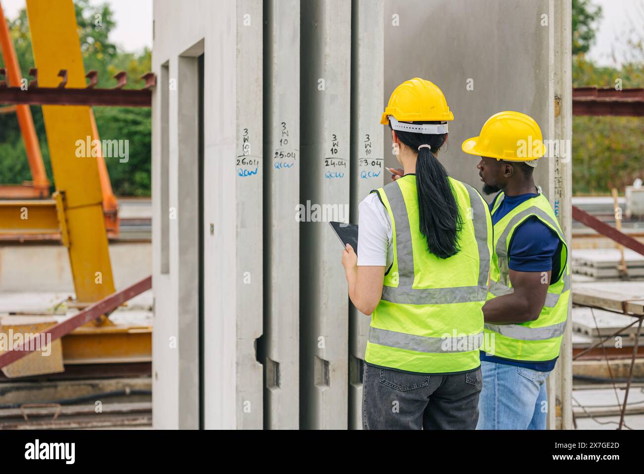 Engineer smart women working contact with African black worker in ...