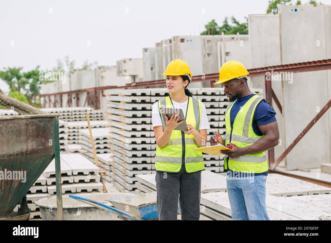 Engineer smart women working contact with African black worker in ...