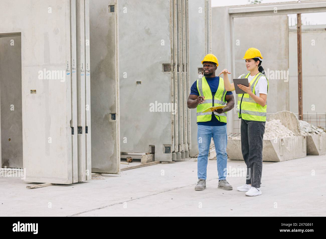 Engineer smart women working contact with African black worker in ...