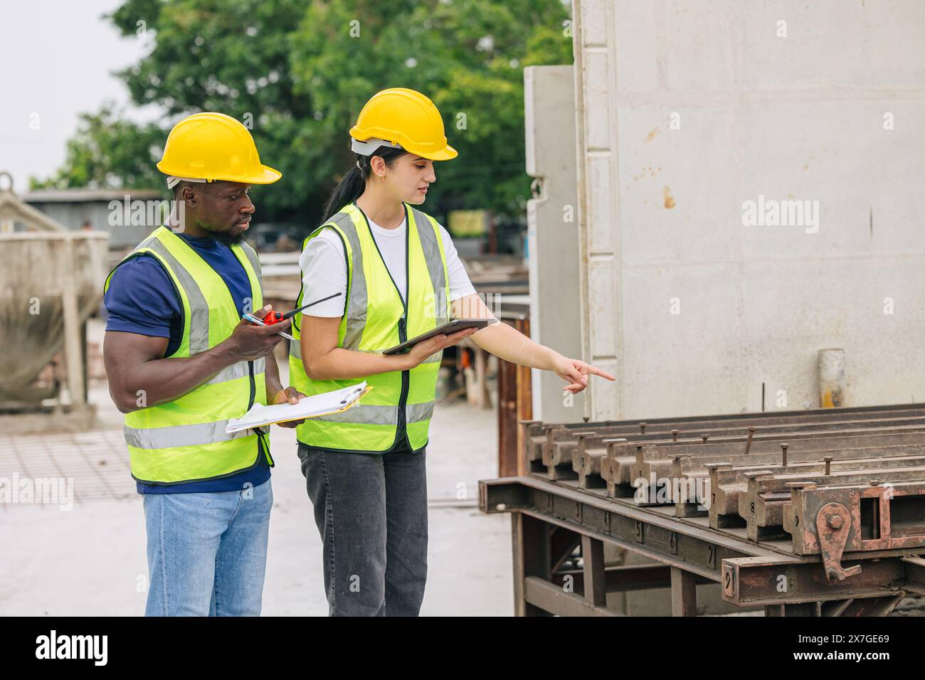 Engineer smart women working contact with African black worker in ...