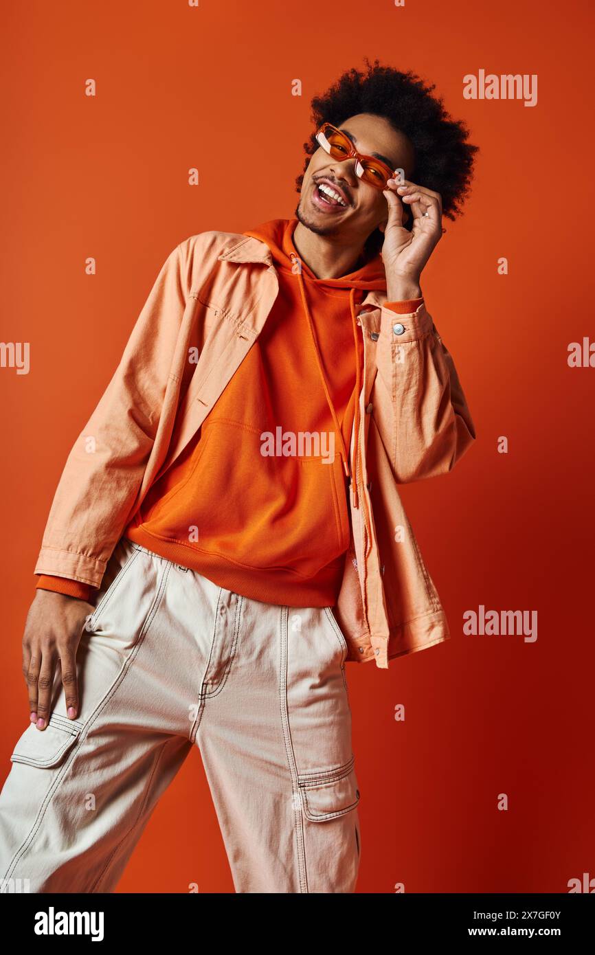 African American man with curly afro hair and sunglasses posing ...