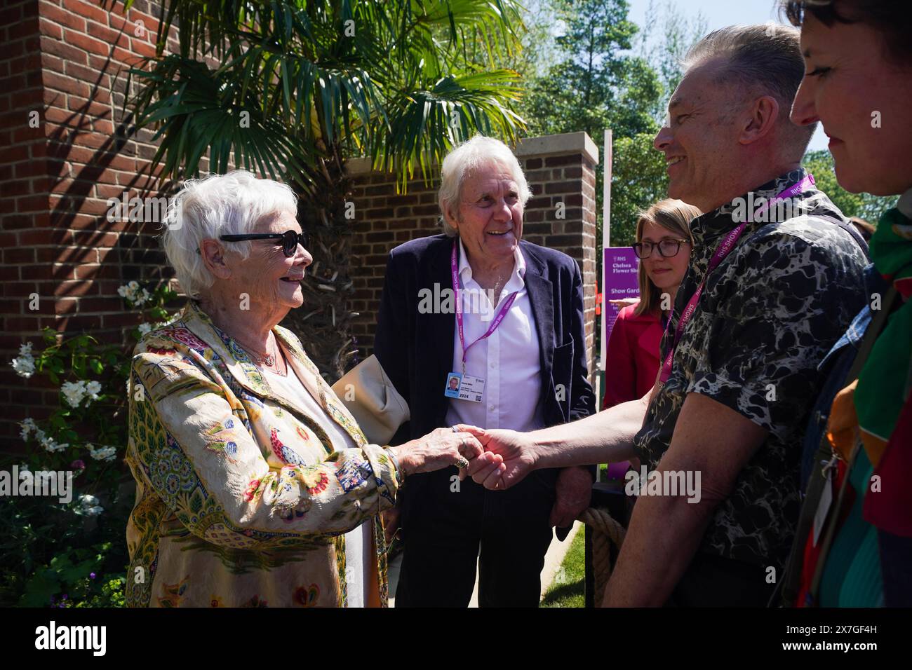 Dame Judi Dench and David Mills, speak with Chris Packham (right ...