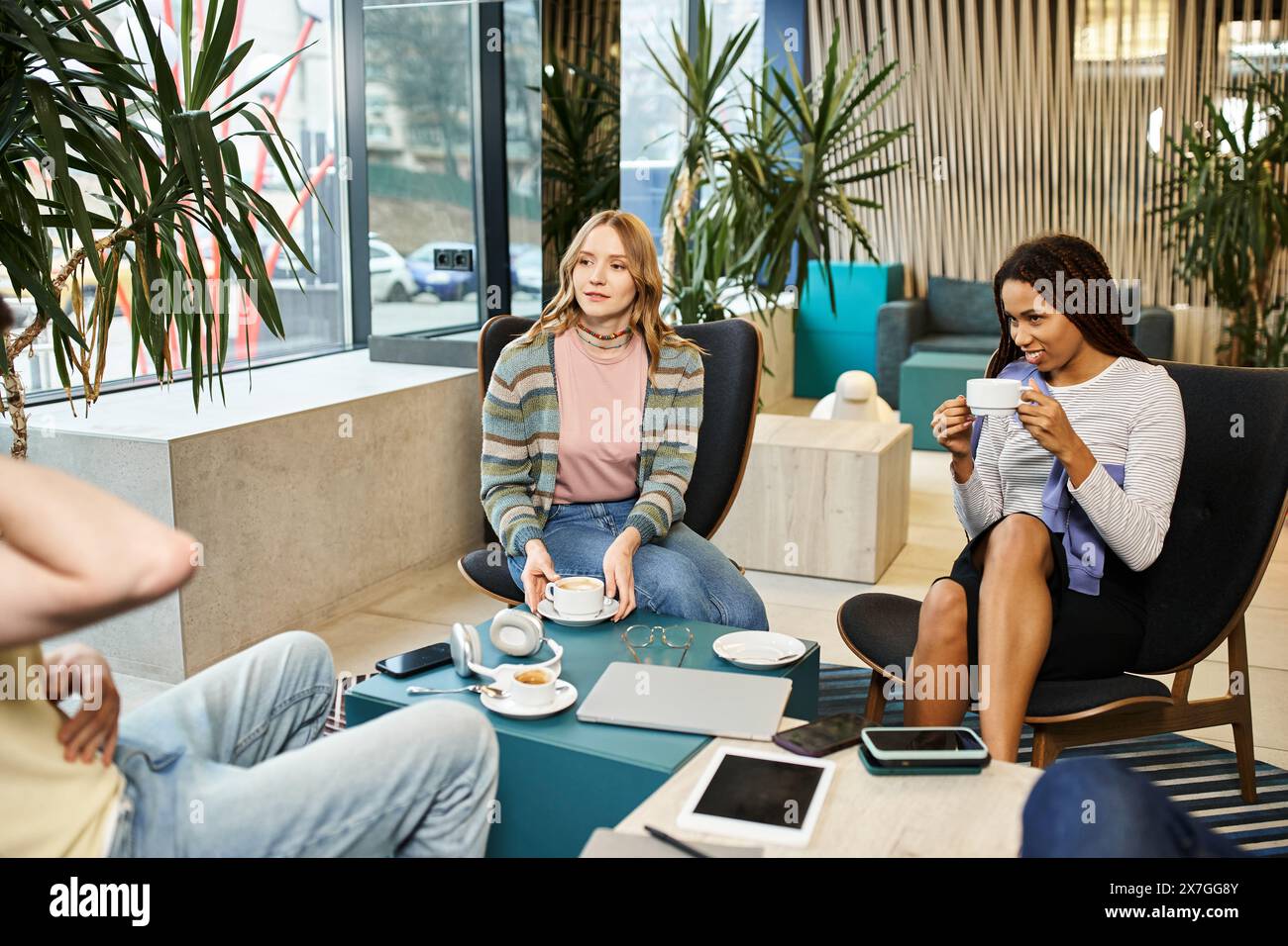 A group of people collaborating and brainstorming ideas while sitting ...