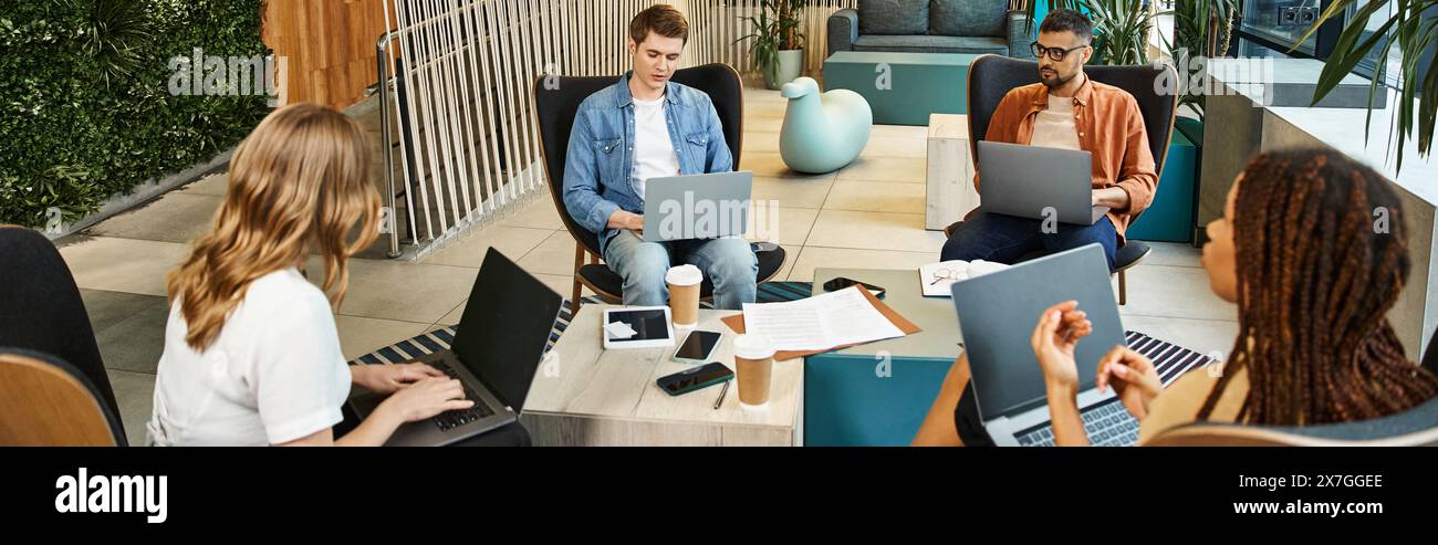 A diverse group of colleagues in a startup team working together around ...