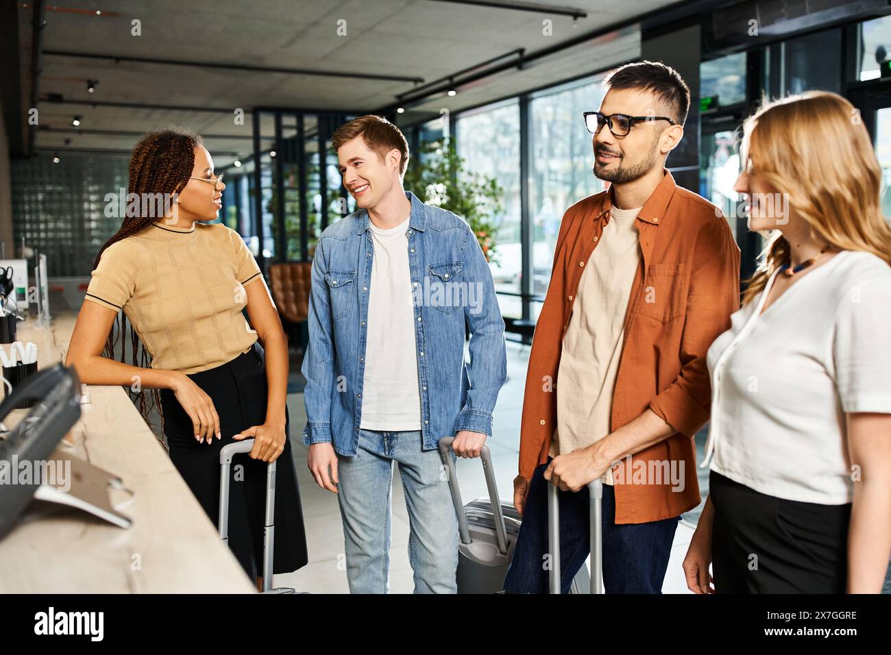 Multicultural colleagues in casual attire standing together in a circle ...