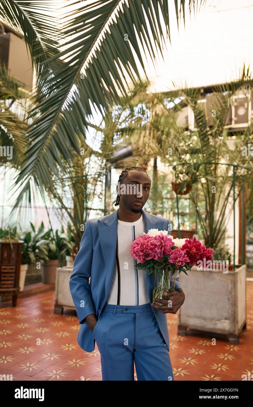 Handsome African American man in a blue suit posing with a bunch of ...