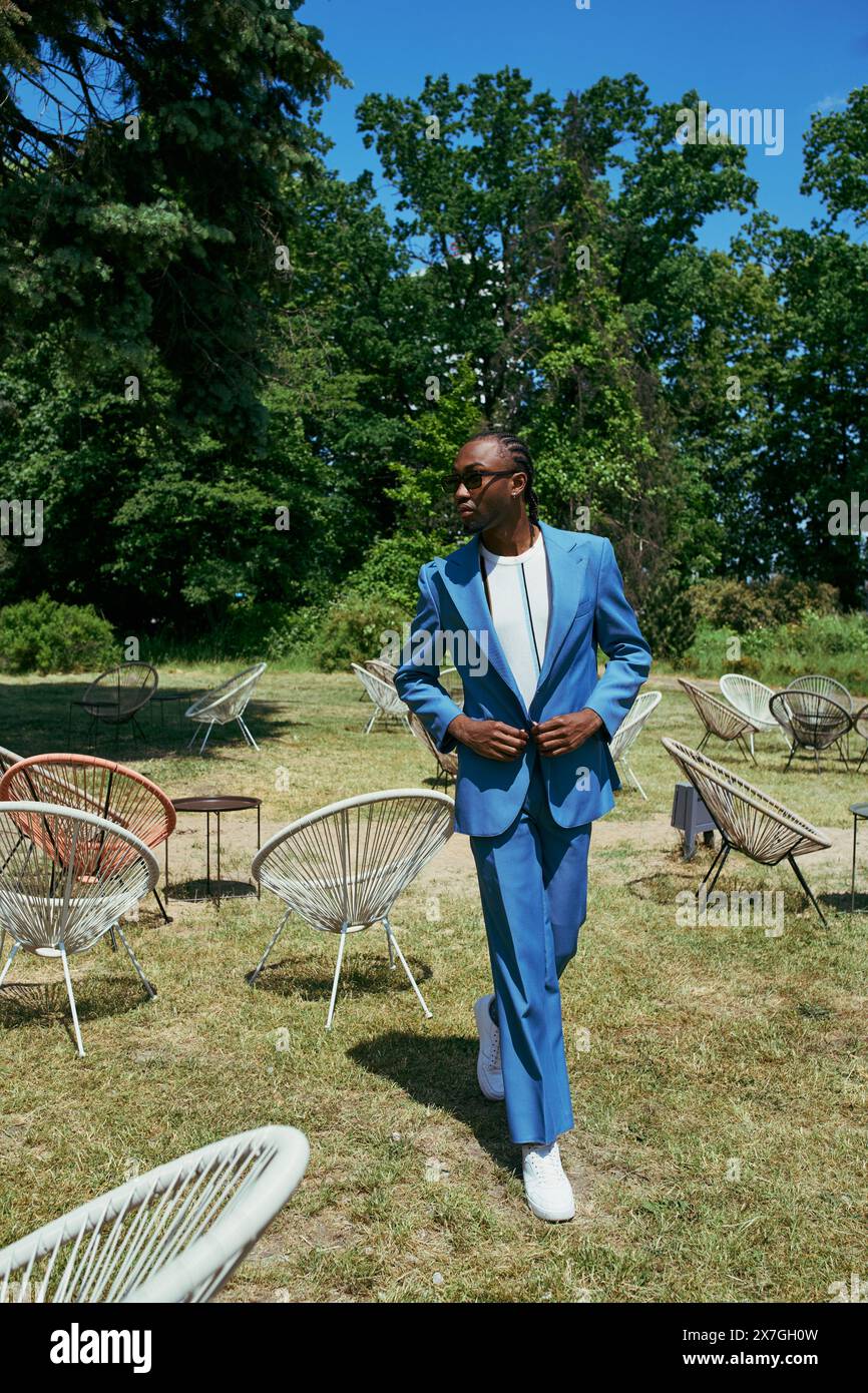Handsome African American man in sophisticated blue suit poses in ...