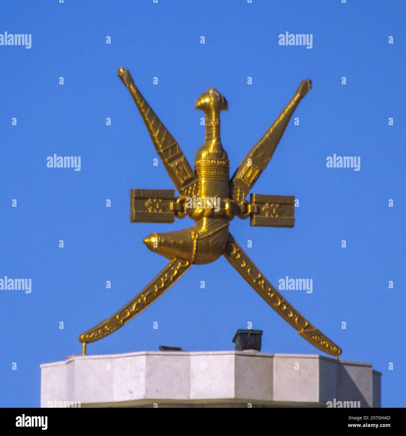 Oman, Muscat. Omani dagger (khanjar) and crossed swords, royal insignia ...