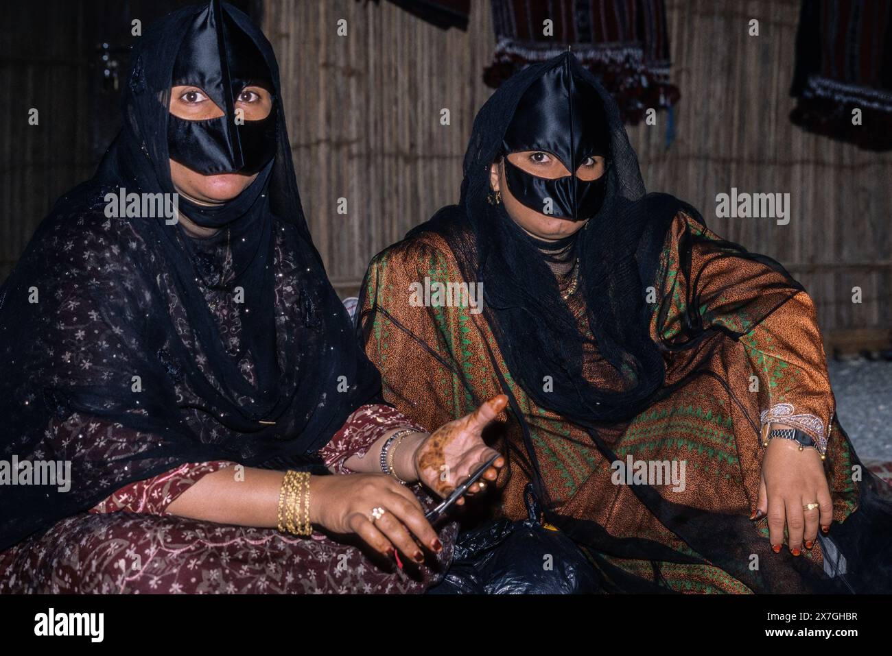 Muscat, Oman, Arabian Peninsula, Middle East. Masked Omani Women. Note ...