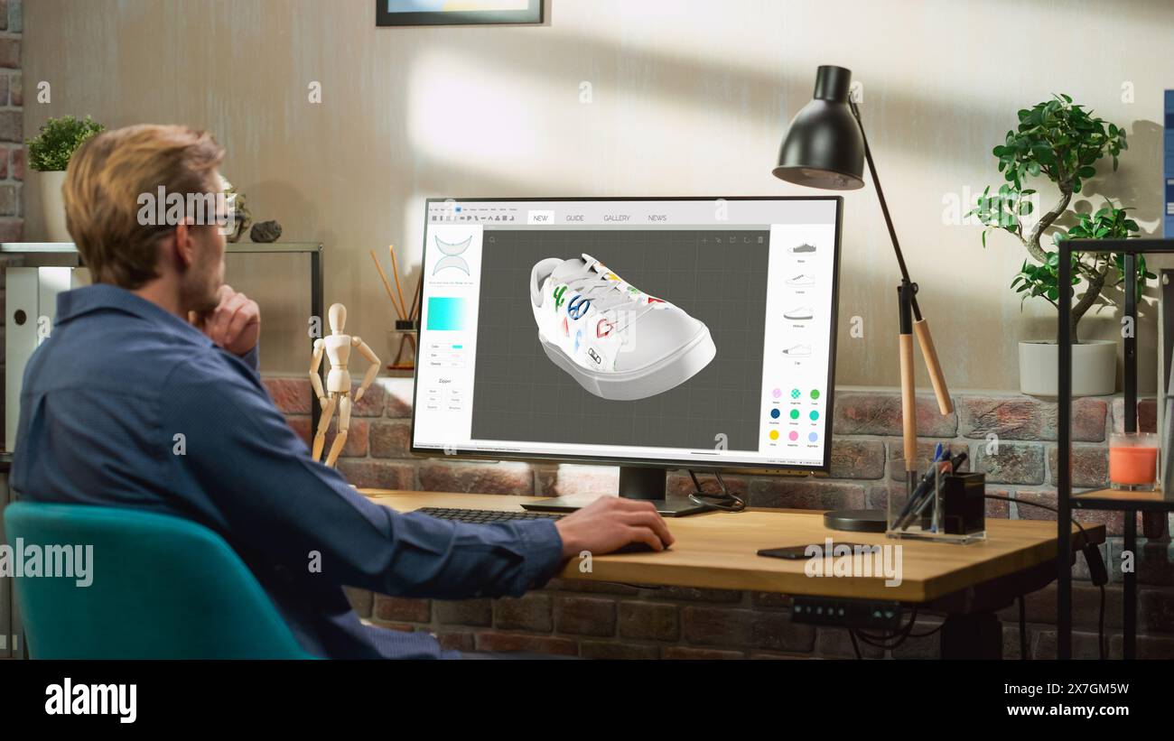 Young Male Footwear Designer Works on 3d Model of Shoe and Change ...