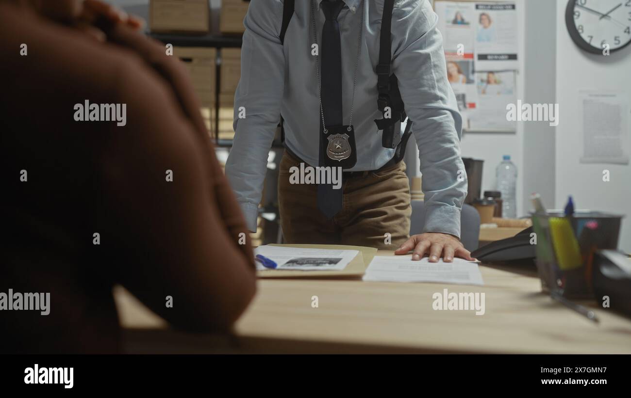 Male detective with badge interrogates woman in police station office ...