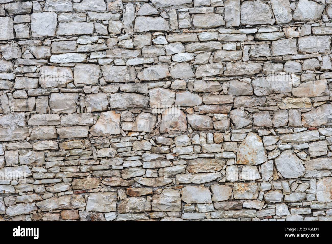 Detailed image of a rock wall showcasing diverse stone patterns and ...