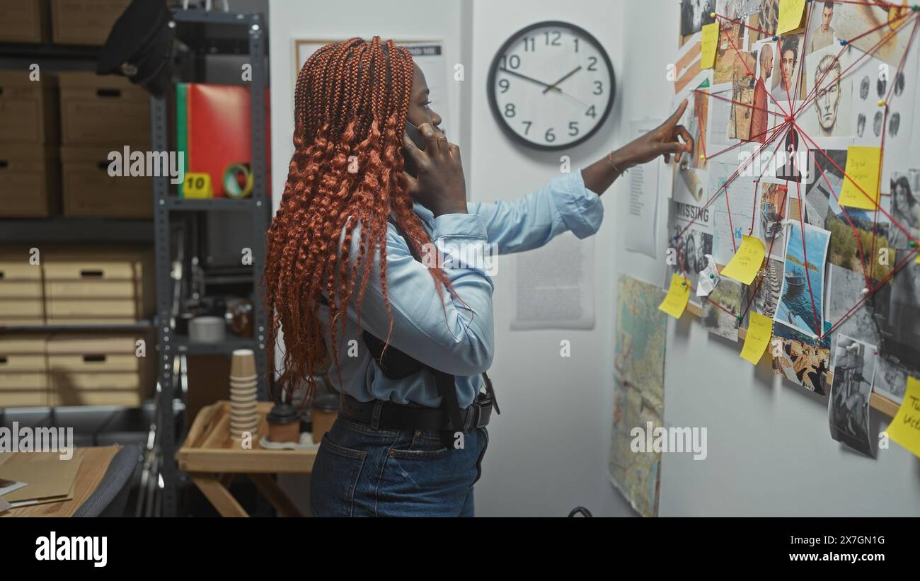 African american woman detective analyzes clues in a police station ...