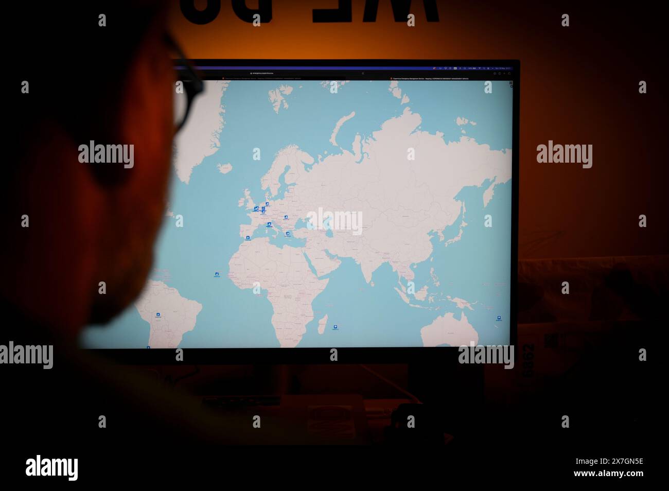 A man is seen viewing a map on a computer screen of the EU's Copernicus ...