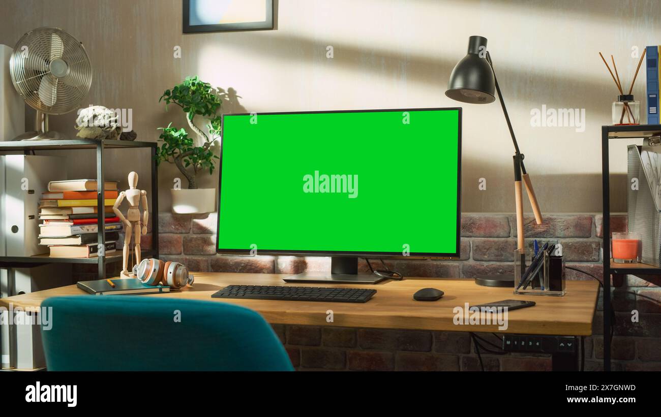 Desktop Computer Monitor Standing on a Desk with a Green Screen ...