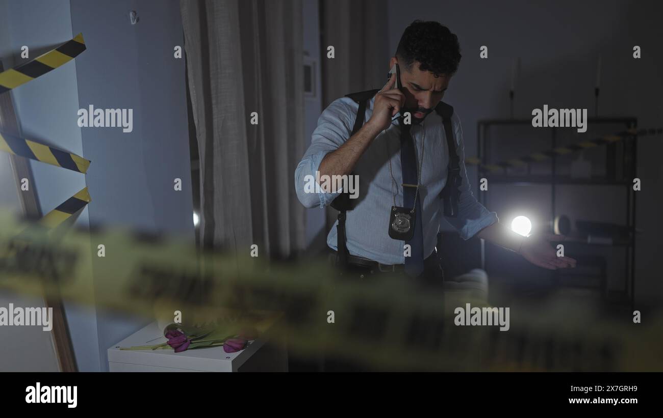 Hispanic detective investigates indoor crime scene at night, using ...
